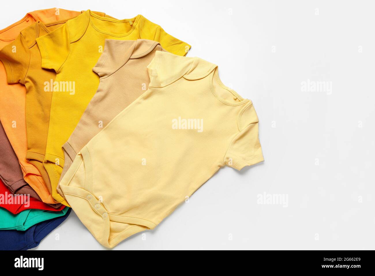 Baby clothes on white background Stock Photo - Alamy