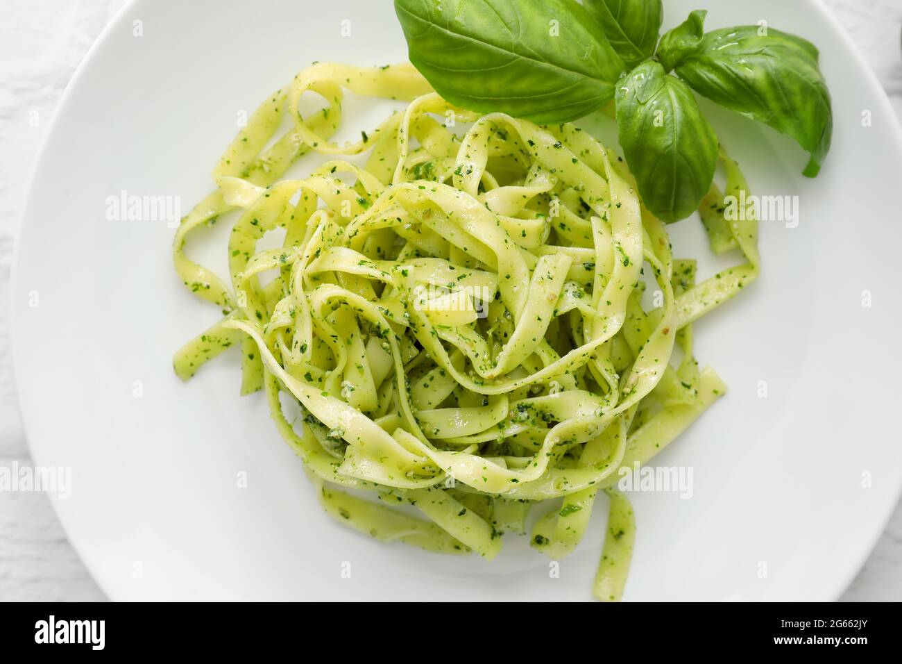 Plate with tasty pesto pasta, closeup Stock Photo - Alamy