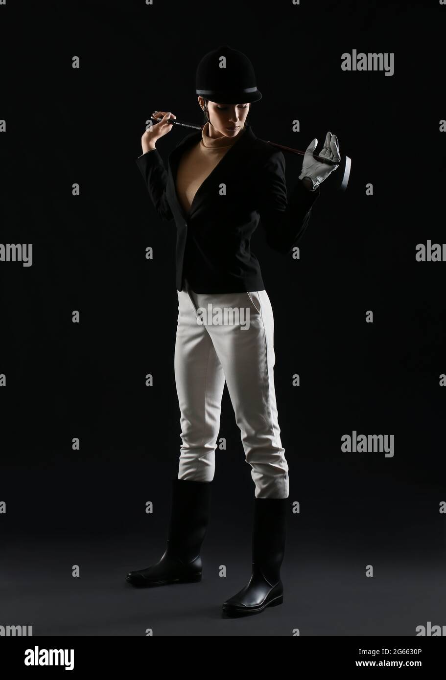 Beautiful female polo player on dark background Stock Photo - Alamy