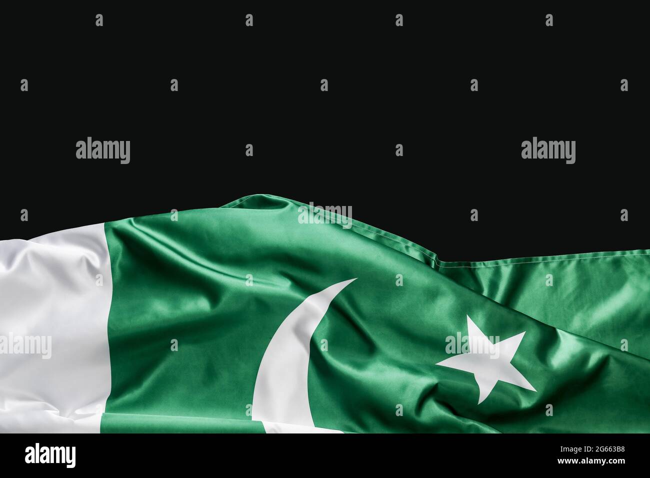 Pakistan flag on dark background Stock Photo - Alamy