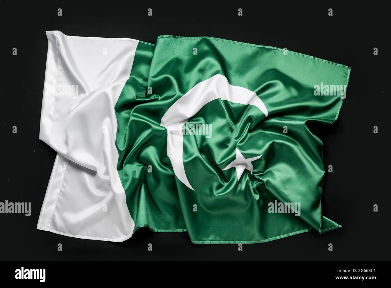 Pakistan flag on dark background Stock Photo - Alamy