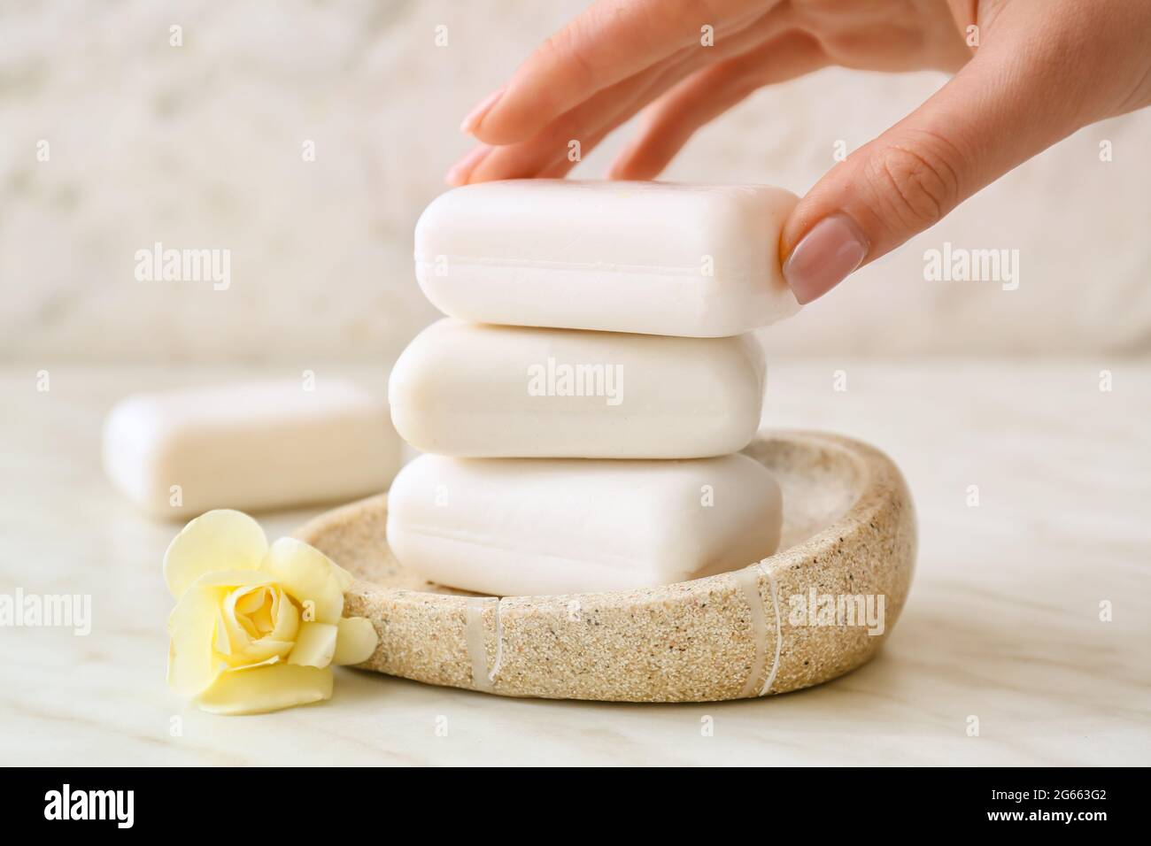 Female hand with soap bars on light background, closeup Stock Photo - Alamy