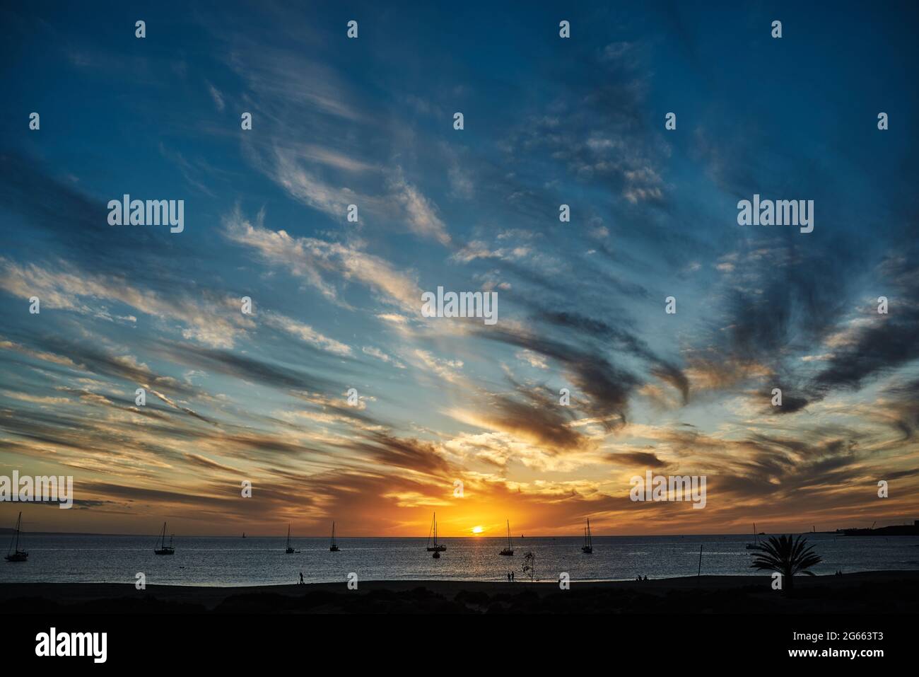 Beautiful sunset on the beach during summer time Stock Photo - Alamy