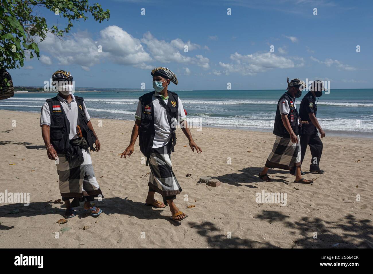 Badung, Bali, Indonesia. 3rd July, 2021. Balinese traditional police of ...
