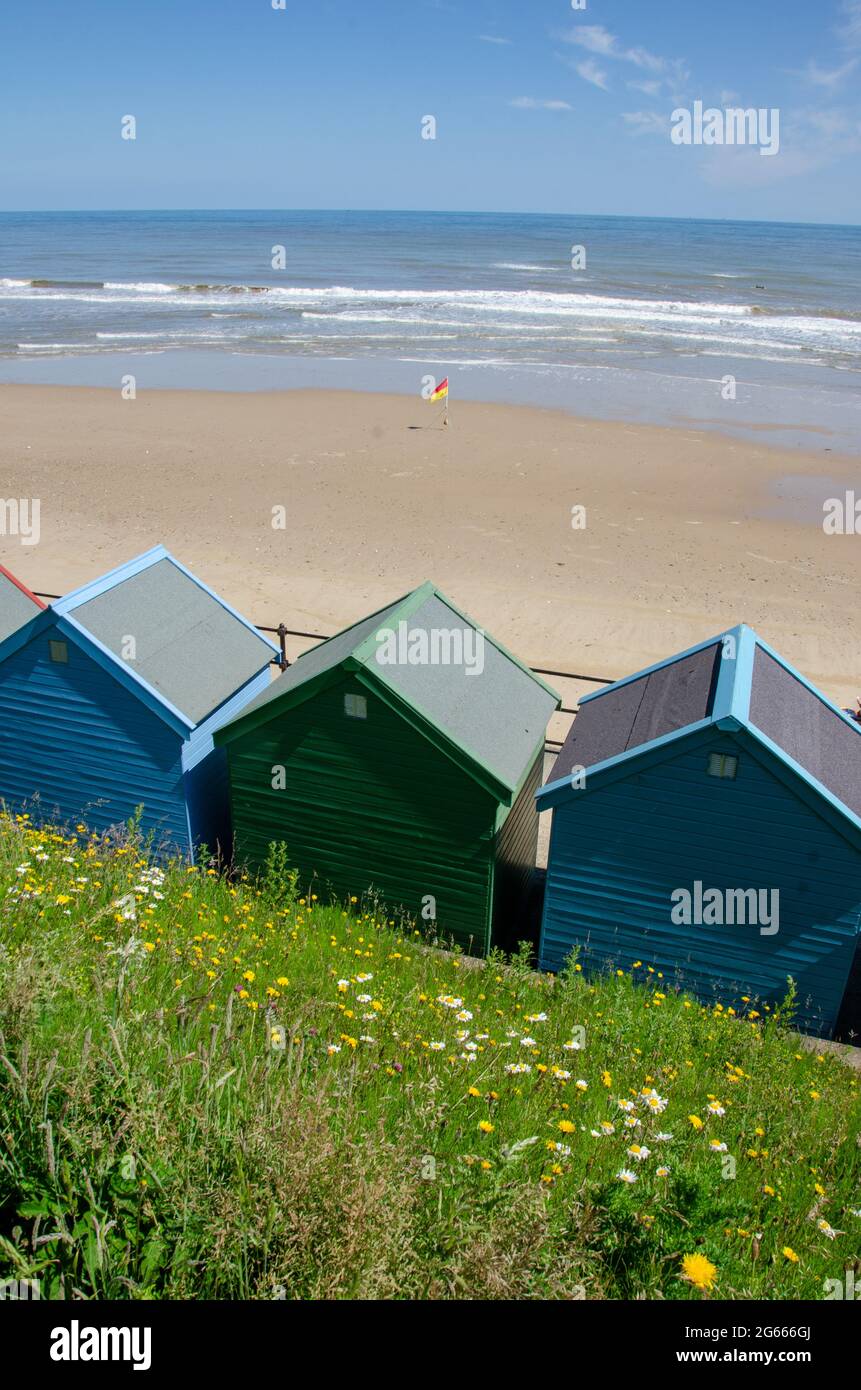 The beach and beach huts at the seaside resort of Mundesley, Norfolk ...