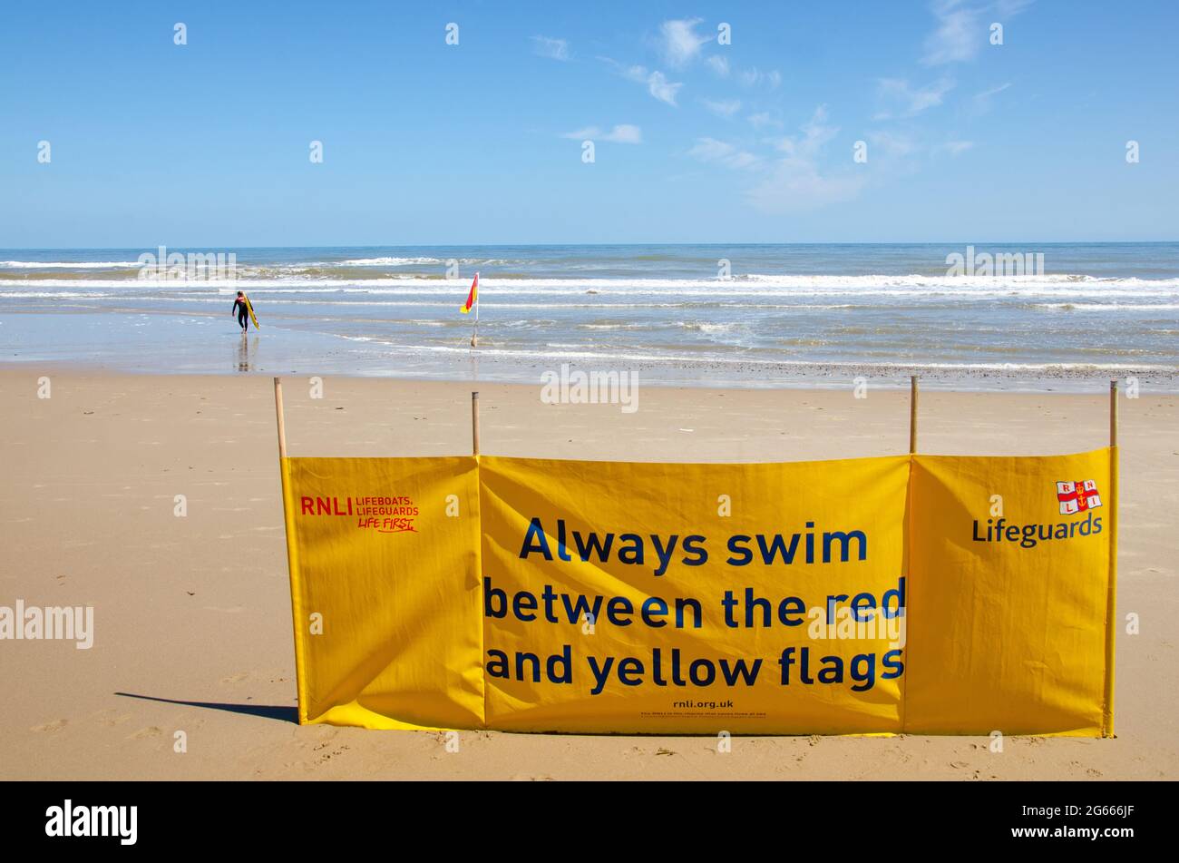 Lifeguard warning signs on the beach at the seaside resort of Mundesley ...