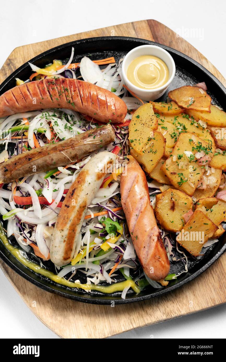 mixed german traditional organic sausage and potato meal platter ...