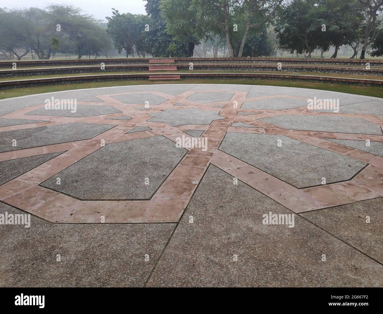 A large public amphitheatre in a park surrounded by trees Stock Photo ...