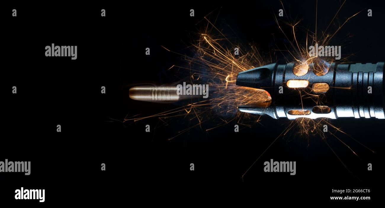 Copper bullet after leaving the barrel of an assault rifle with sparks ...