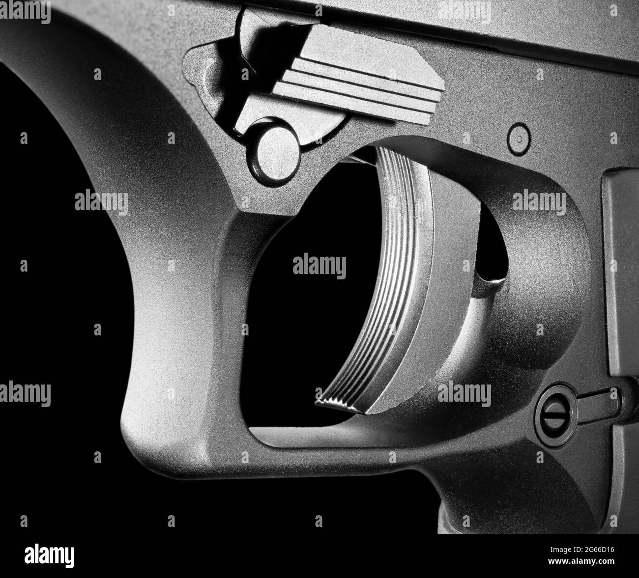 Trigger from a large and metal semi-automatic handgun that is up close ...