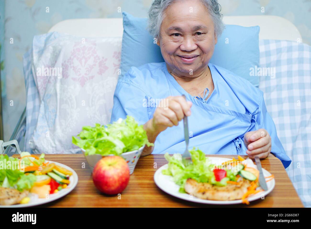 Asian senior or elderly old lady woman patient eating breakfast healthy ...