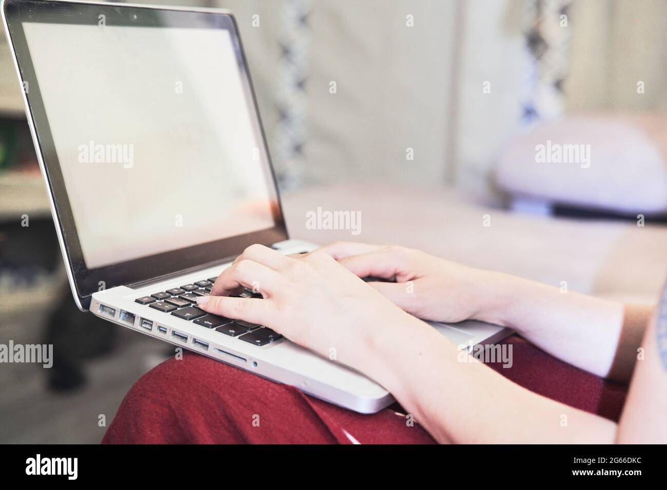 Back view of an anonymous woman using a computer. Concept of technology ...