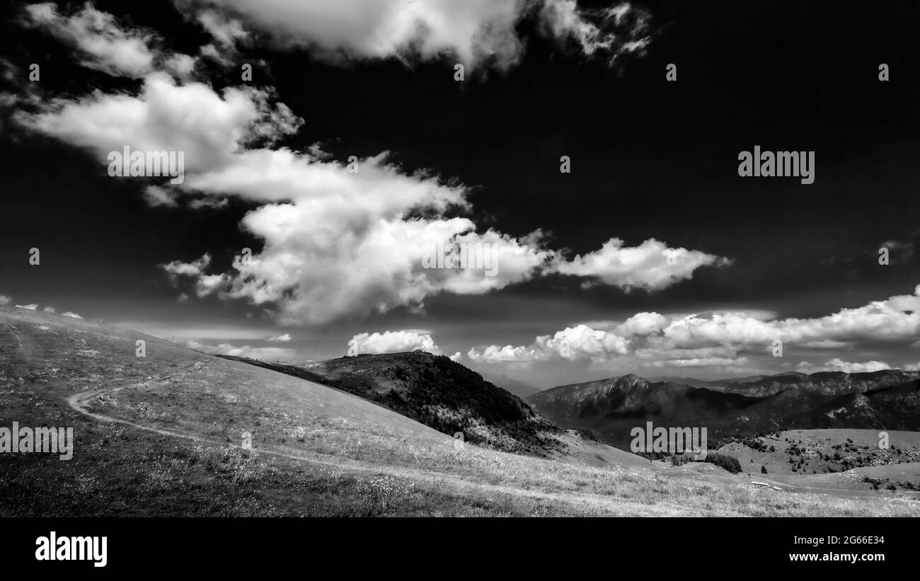 Hills landscape with clouds Stock Photo - Alamy
