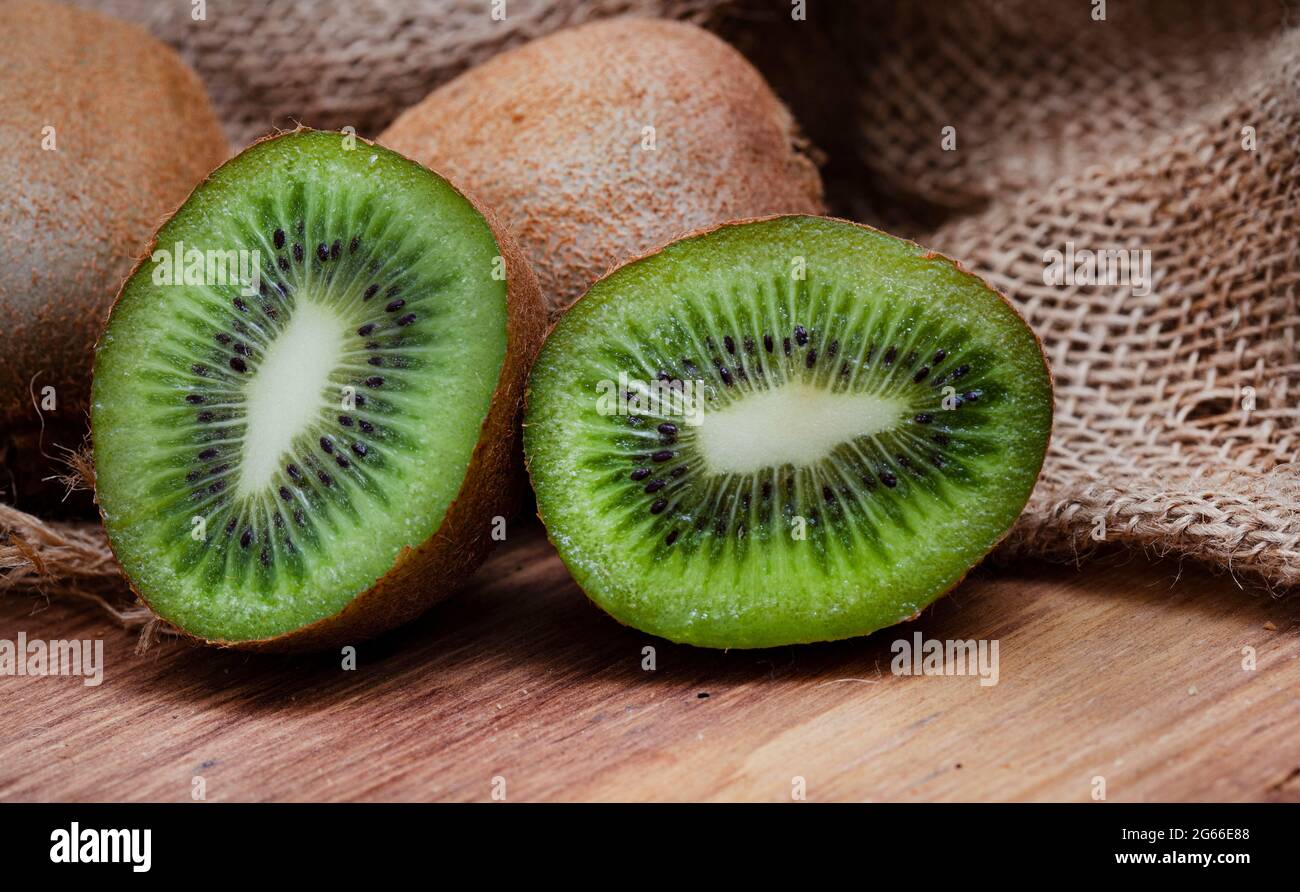 fresh tropical fruits on rustic farm style table Stock Photo - Alamy