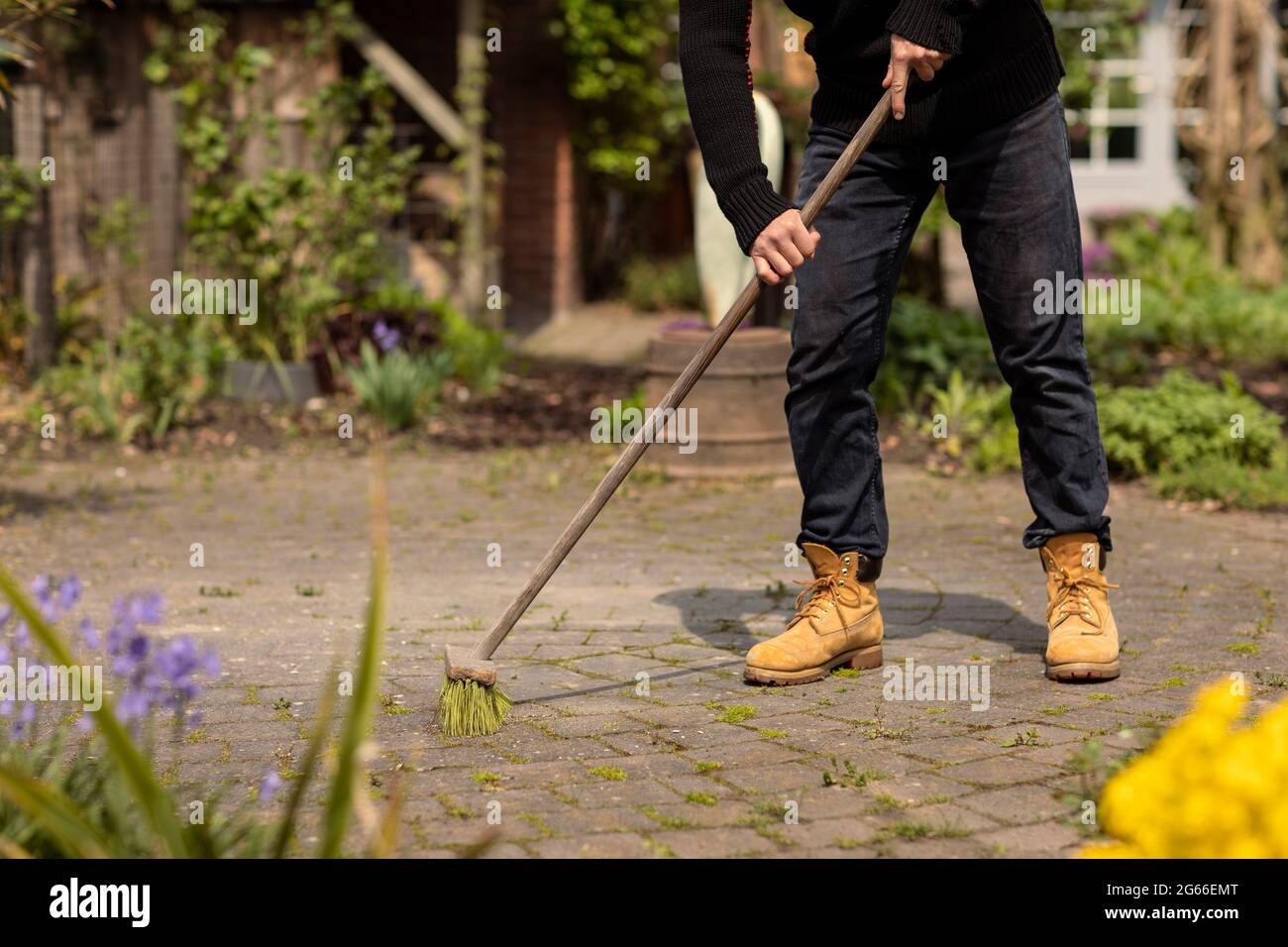 Cleaning a patio with a broom hi-res stock photography and images - Alamy