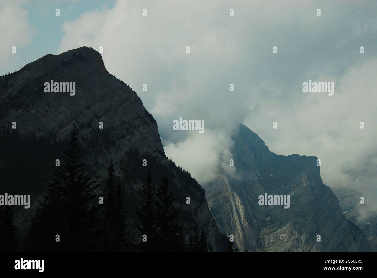 Panoramic overview of high Rocky Mountain peaks surrounded by clouds ...