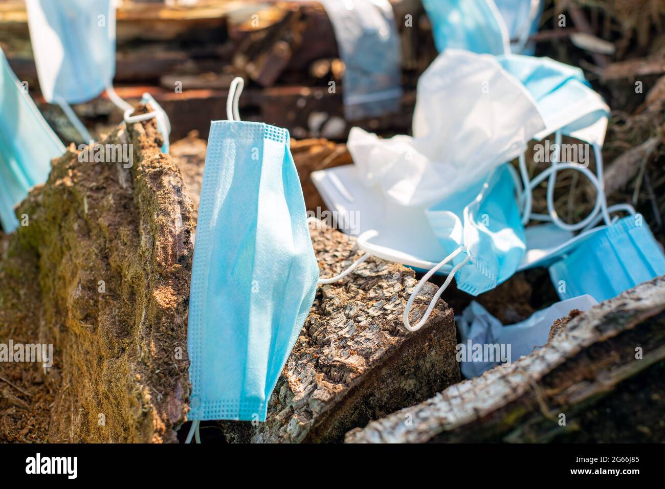 Used face masks in trash. Environmental pollution concept Stock Photo ...