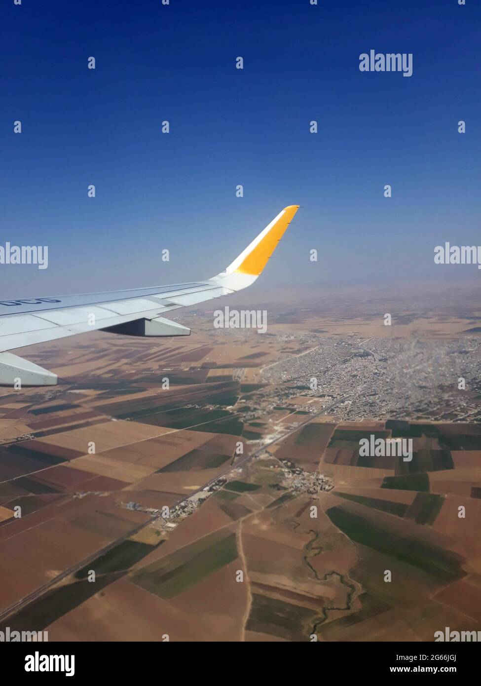 Airplane windows view above the earth. View from an airplane window ...