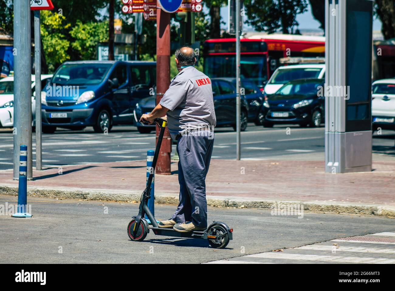Seville Spain July 02, 2021 People rolling with an electric scooter in ...
