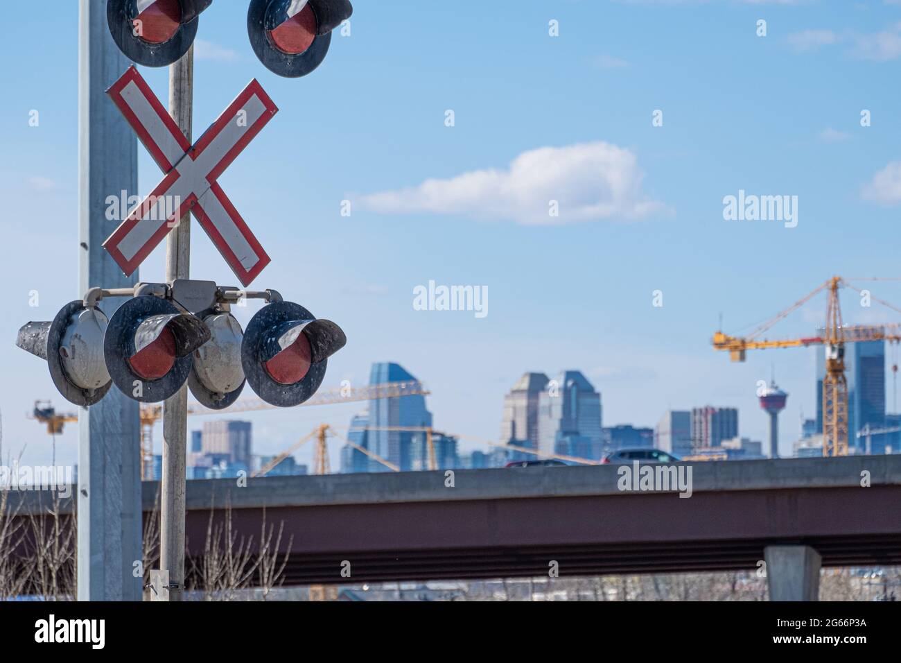 Train Signals with Calgary skyline in the distance Stock Photo - Alamy