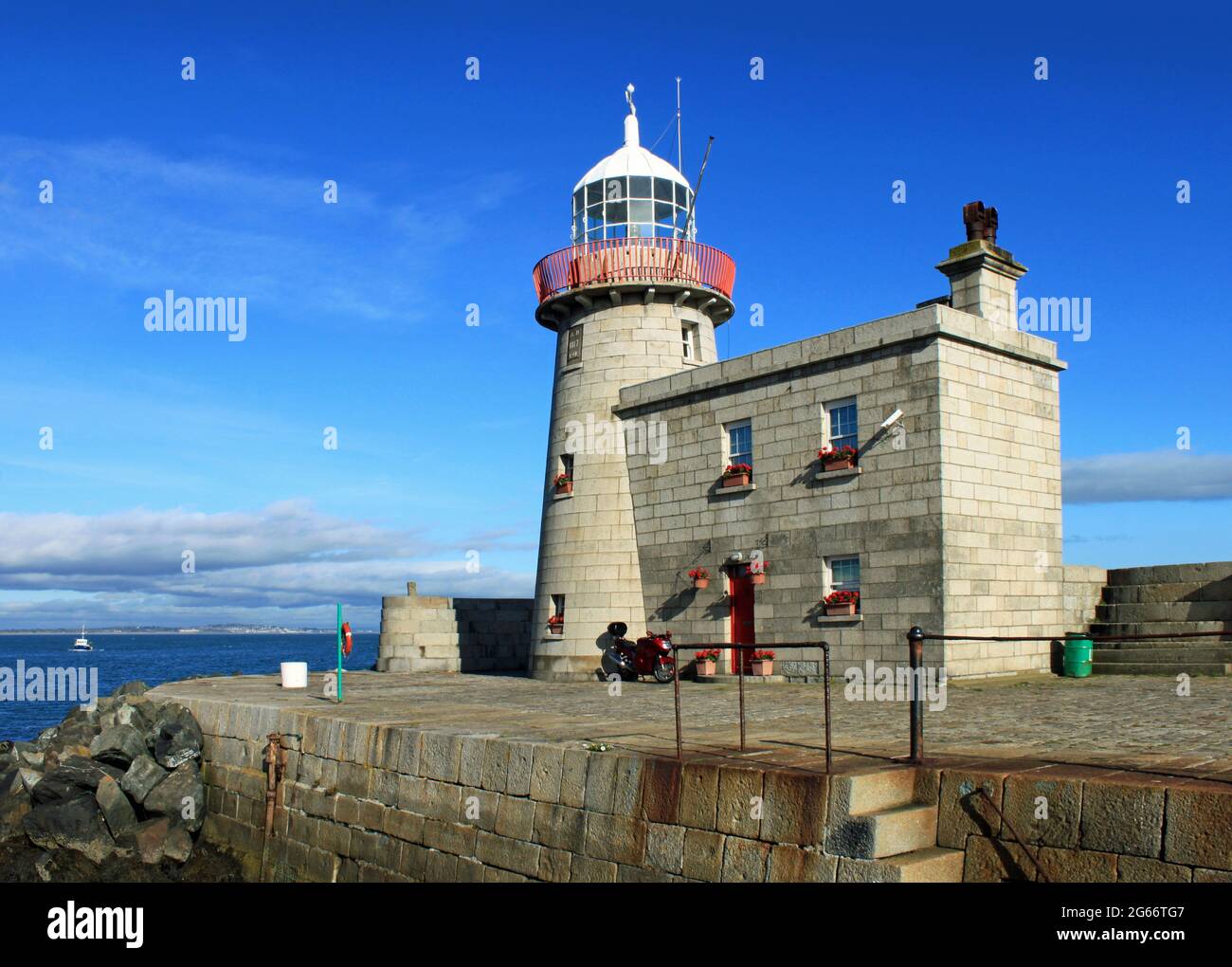 The old cut stone lighthouse at Howth Harbour, County Dublin, Ireland ...