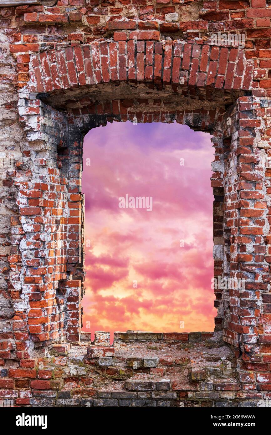 window into a brick wall overlooking the sunset sky. High quality photo ...