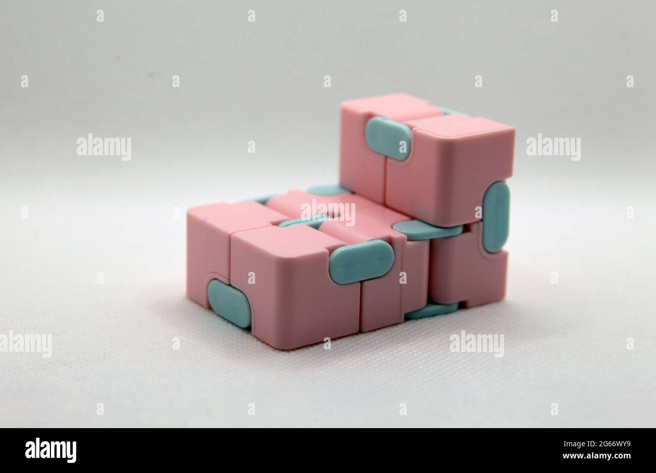 Pink and blue infinity cube with white background Stock Photo - Alamy