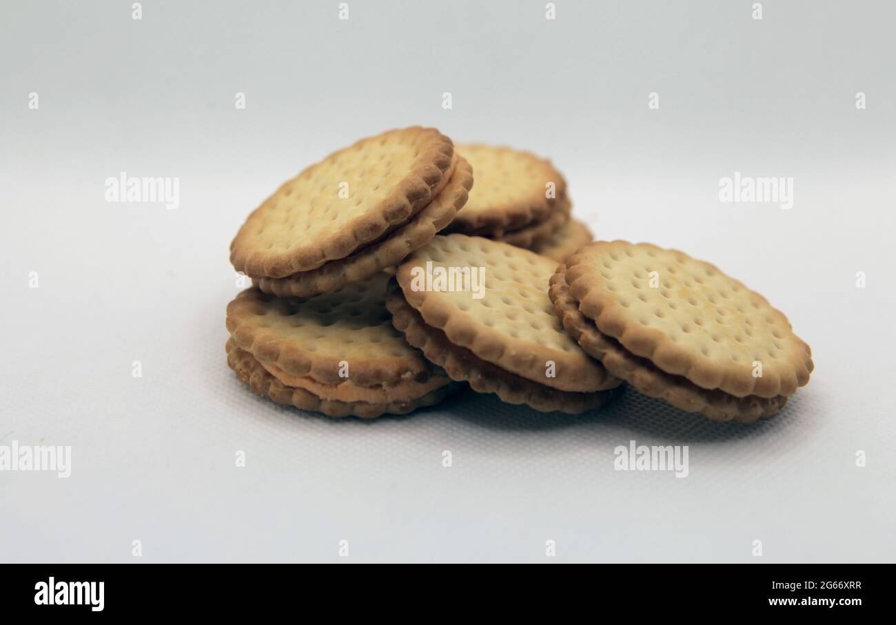 Group shoot of stacked biscuits isolated white background Stock Photo ...