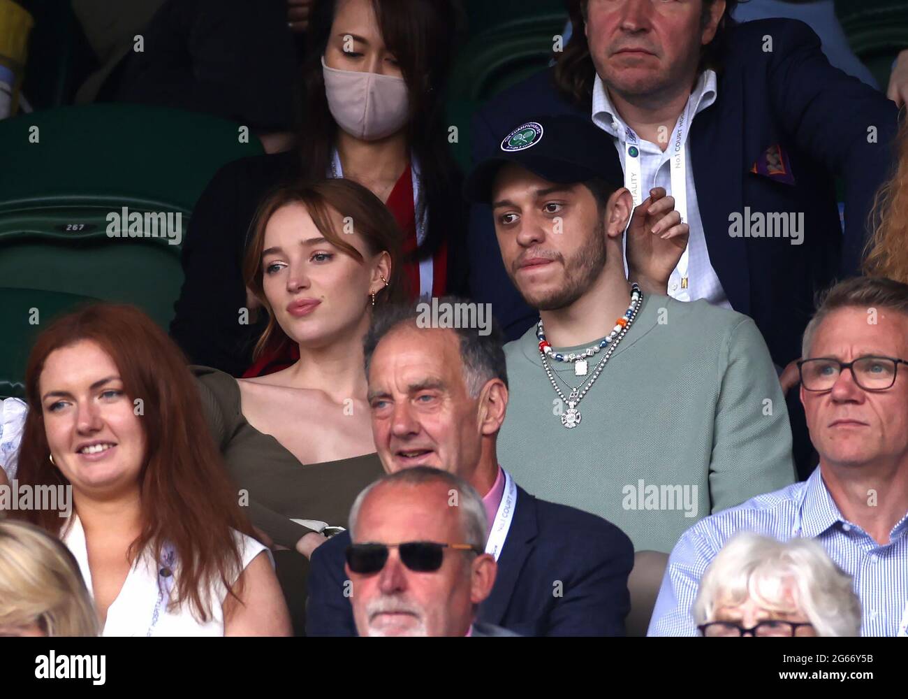 Phoebe Dynevor and Pete Davidson watch a match at centre court on day ...
