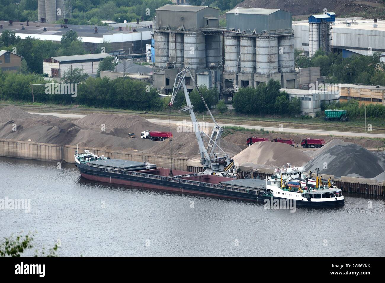 Barge on the river Unloading river sand from a barge Navigable river ...