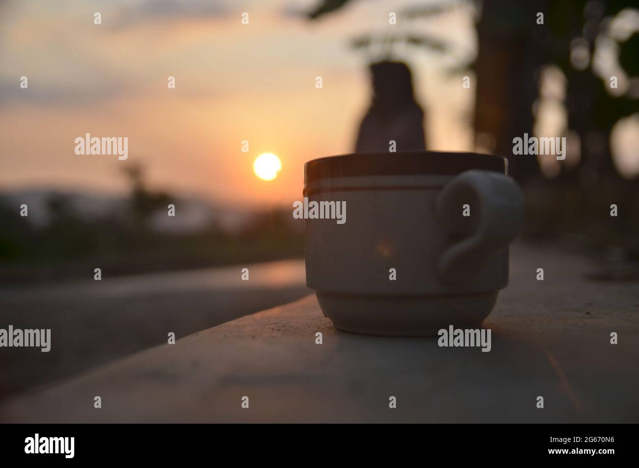 sunset and coffee Stock Photo - Alamy