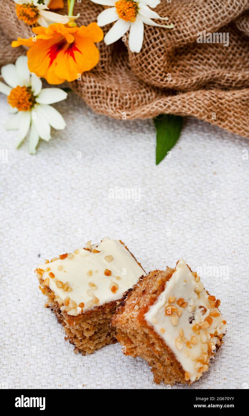 carrot cake squares on farm style table Stock Photo - Alamy
