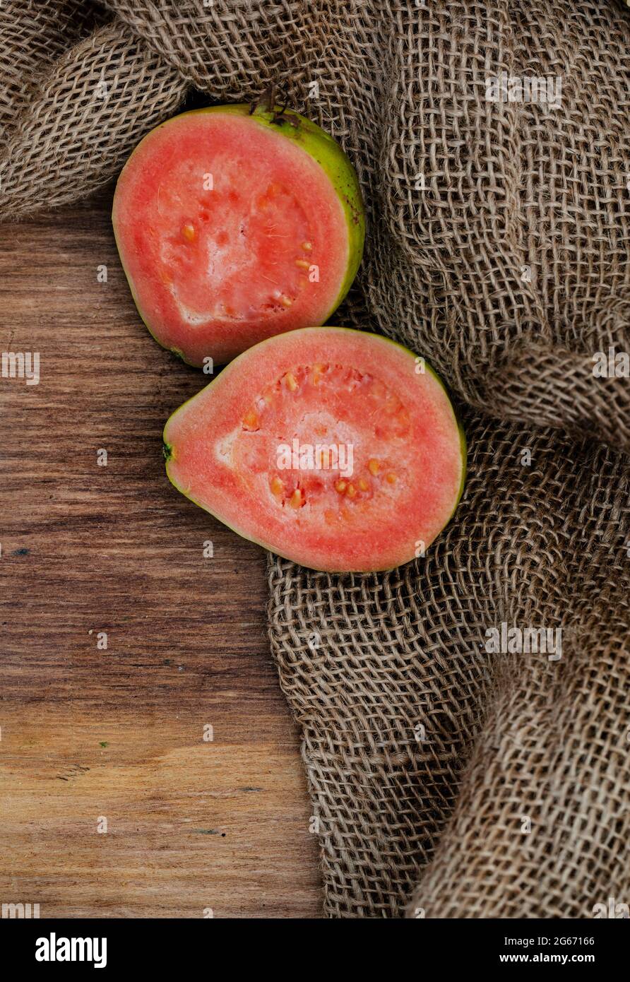 fresh tropical fruits on rustic farm style table Stock Photo - Alamy