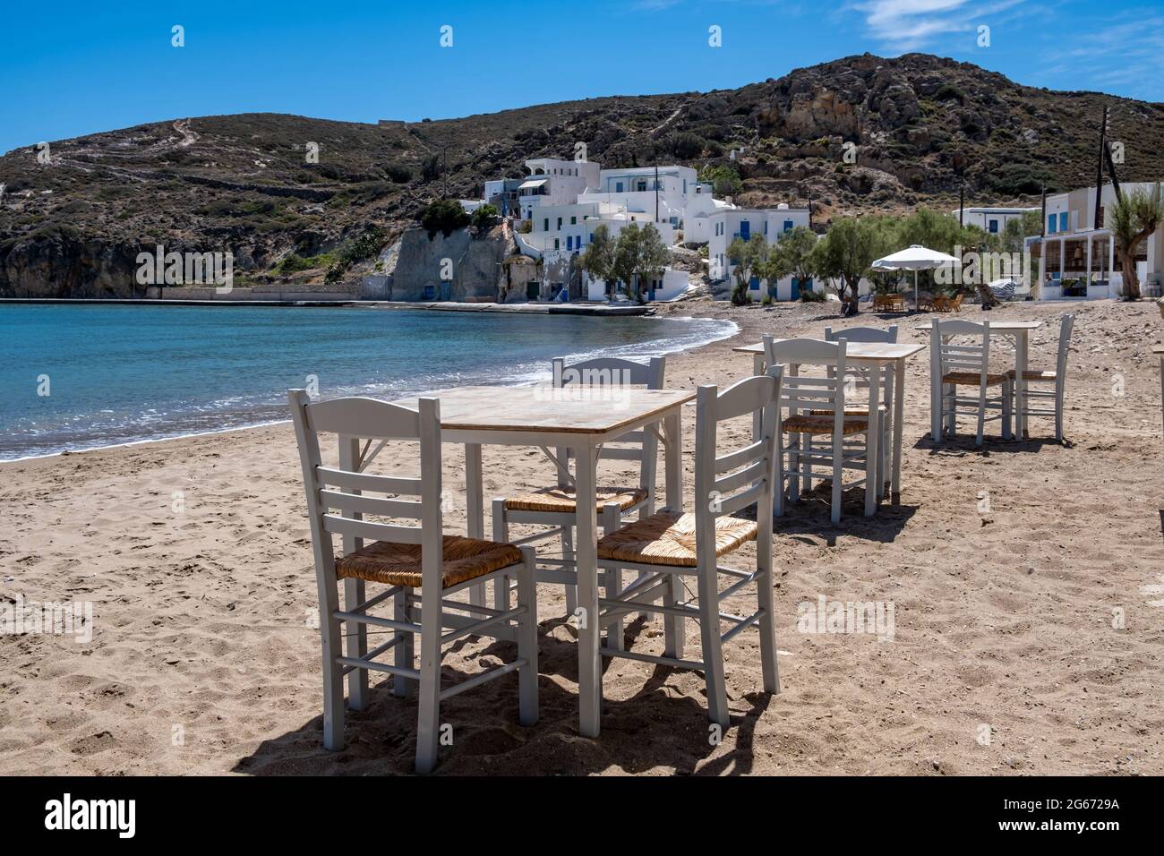 Greek island outdoor tavern. Typical seaside taverna table and chairs ...