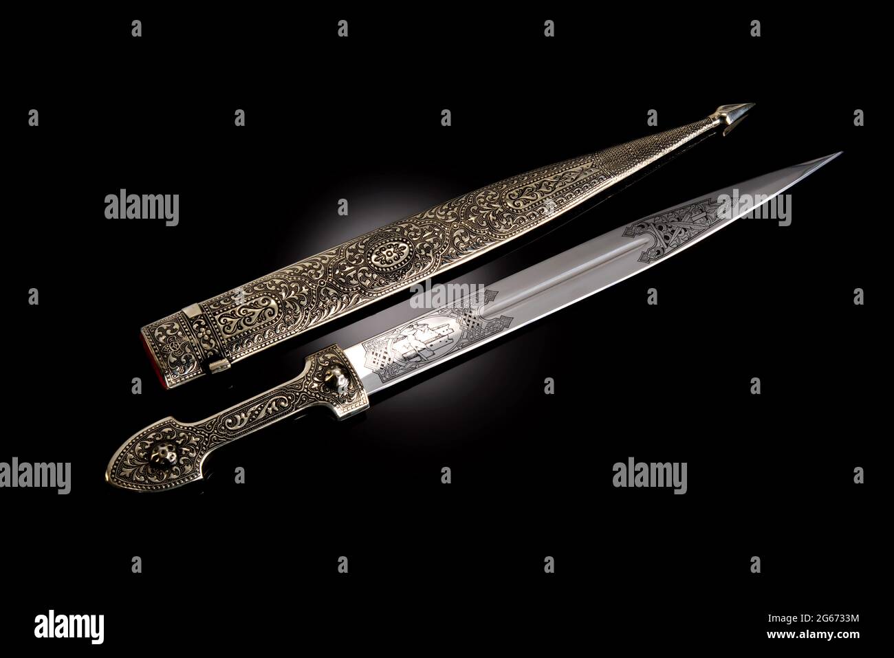 collectible silver dagger with scabbard on black. Luxury weapons with ...