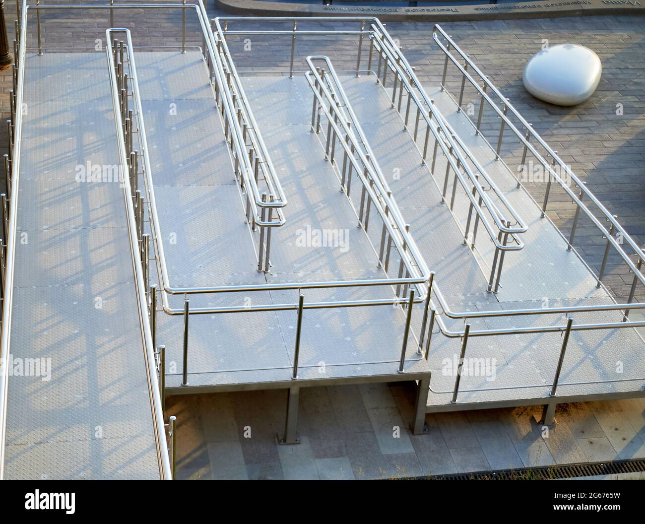 A long zigzag ramp for strollers and wheelchairs. Amenities for people ...