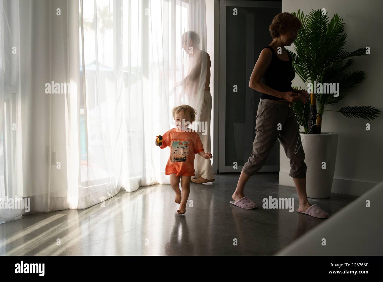 A young boy running indoors Stock Photo - Alamy