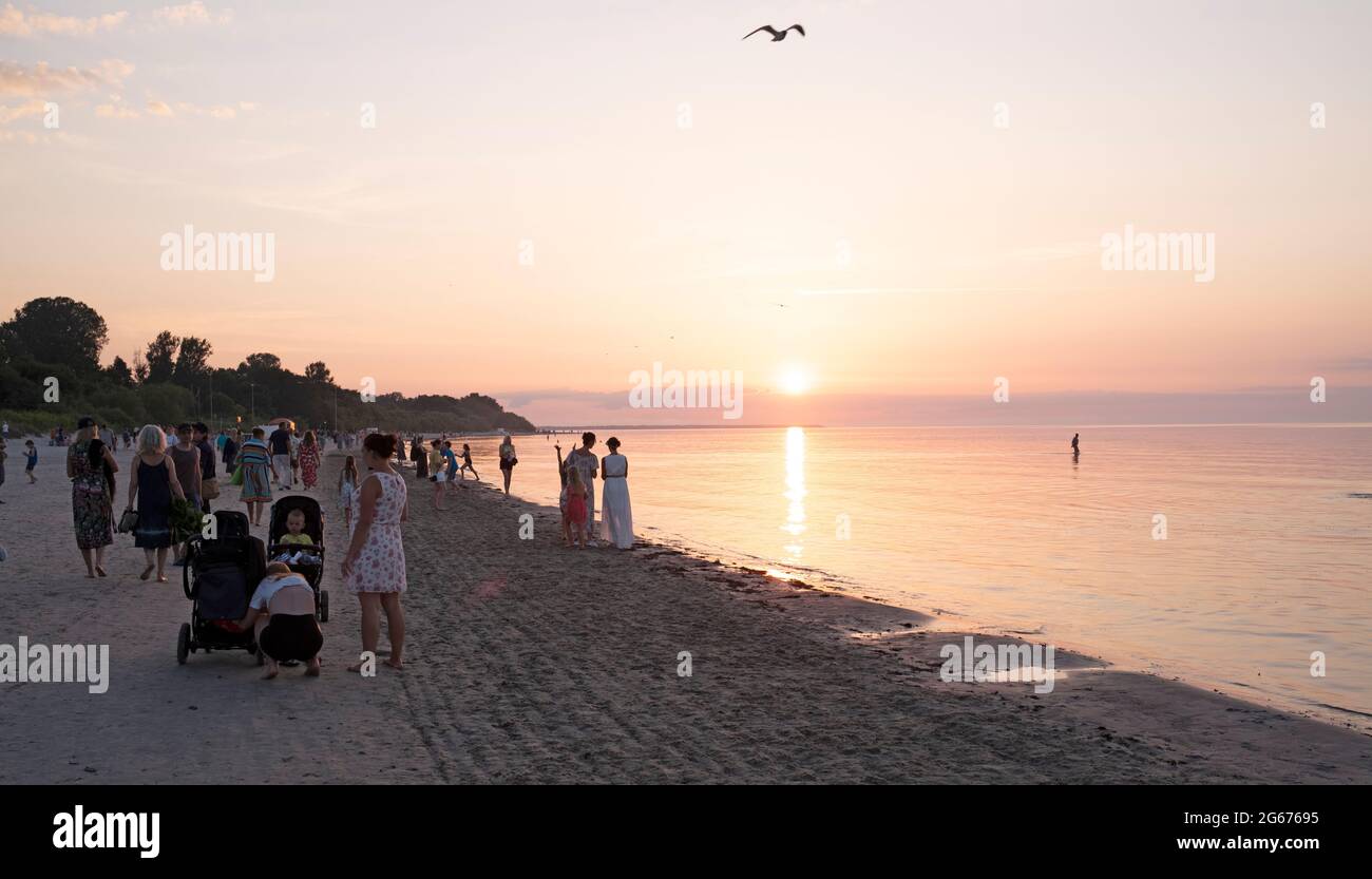 People walking on beach at seaside resort in Kauguri Jurmala Latvia ...