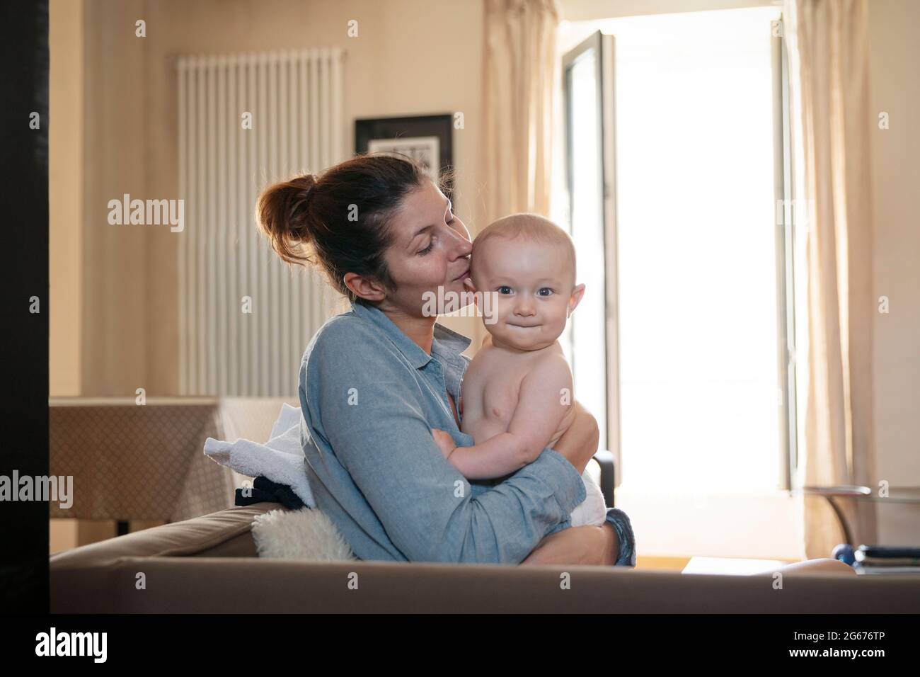 Boy hugging mum hi-res stock photography and images - Alamy