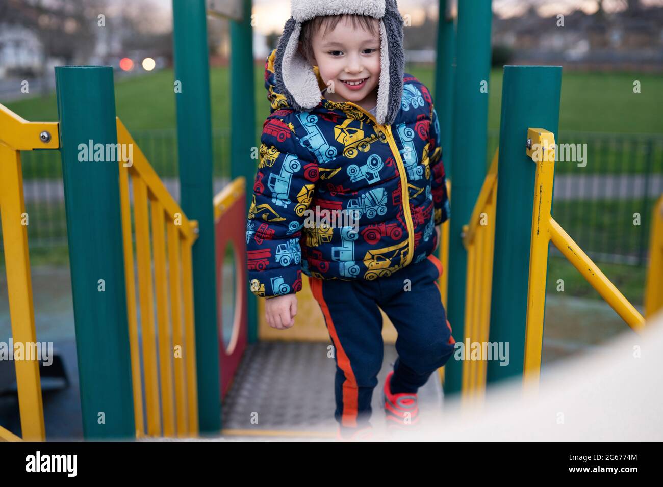 A portrait of a young boy in a playground Stock Photo - Alamy