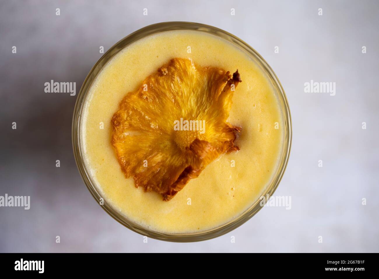 Pineapple cocktail with crispy pineapple garnish Stock Photo - Alamy
