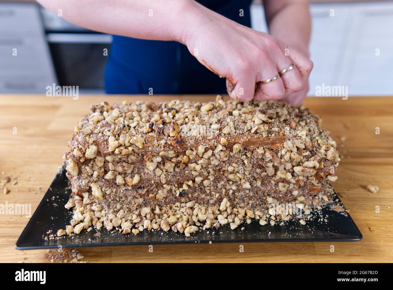 The process of making a chocolate cake with nuts and cream Stock Photo ...