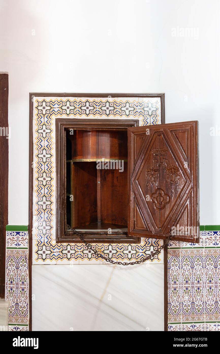 Old wooden lathe rotary to pass objects from one part to another in a ...