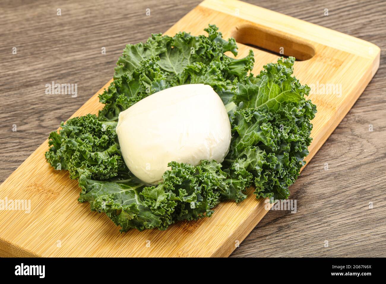 Soft Italian mozzarella cheese over board Stock Photo - Alamy