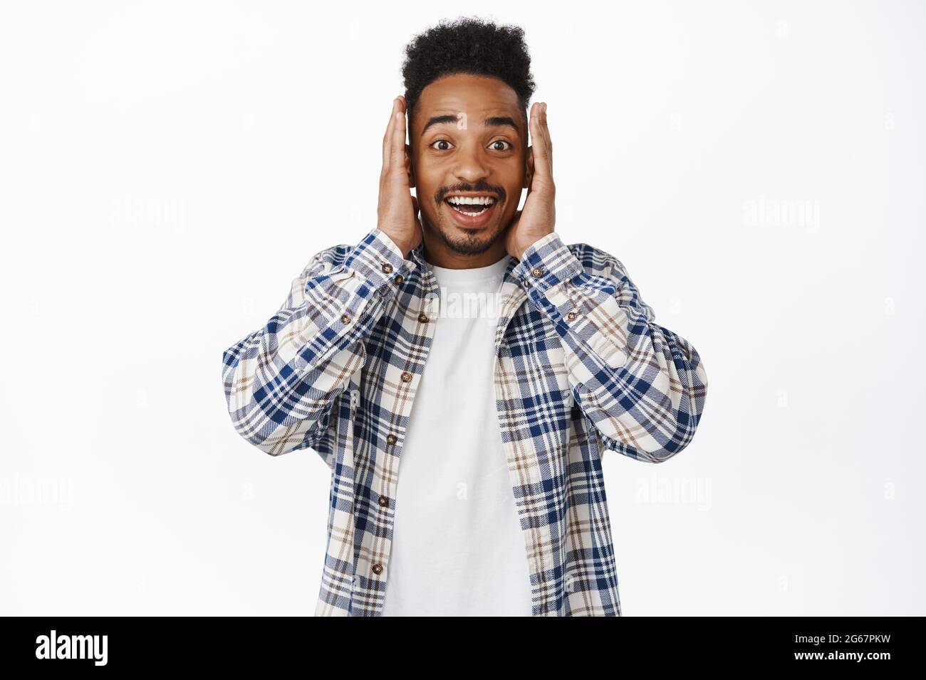 Face expression. Happy and excited african american man look amazed ...