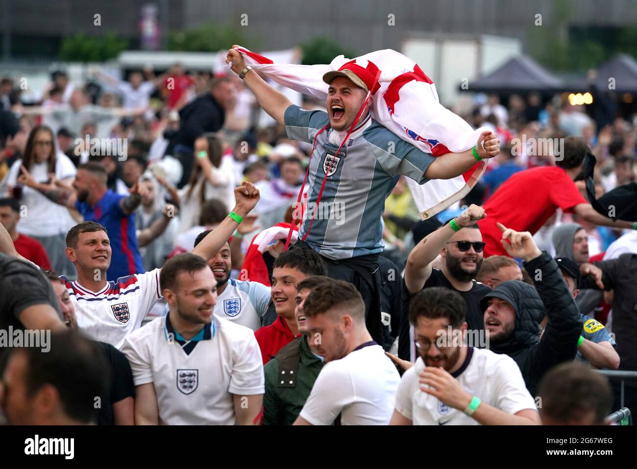 Fans in Manchester celebrate in the fan zone during the Euro 2020 ...