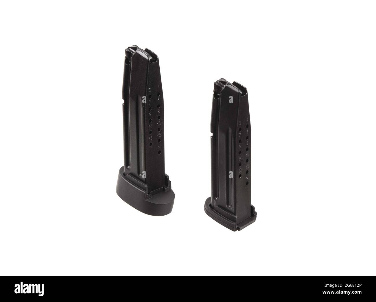 Handgun magazine on white surface. Weapon clips. Isolate on a white ...