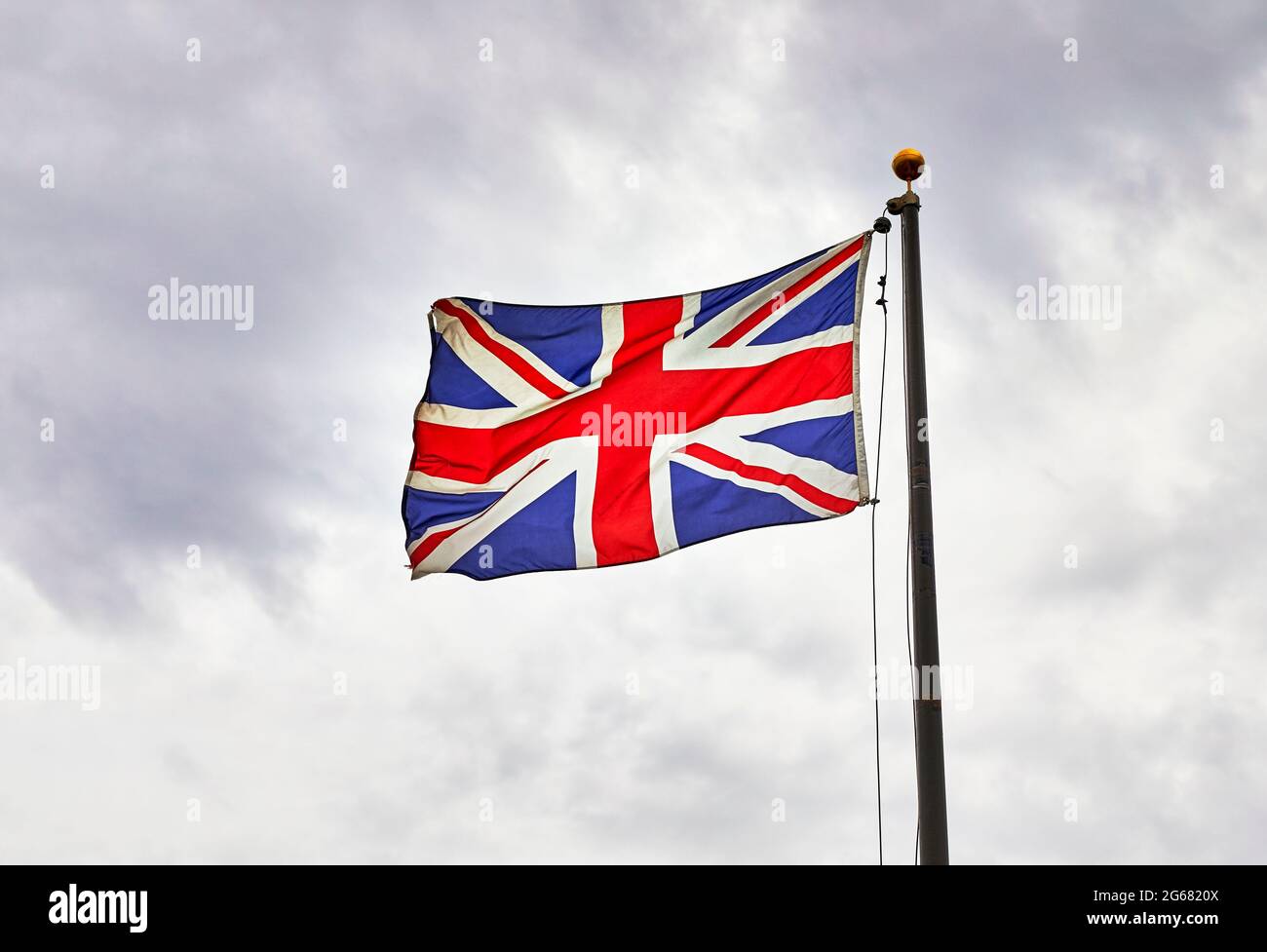 British flag flying on flagpole Stock Photo - Alamy