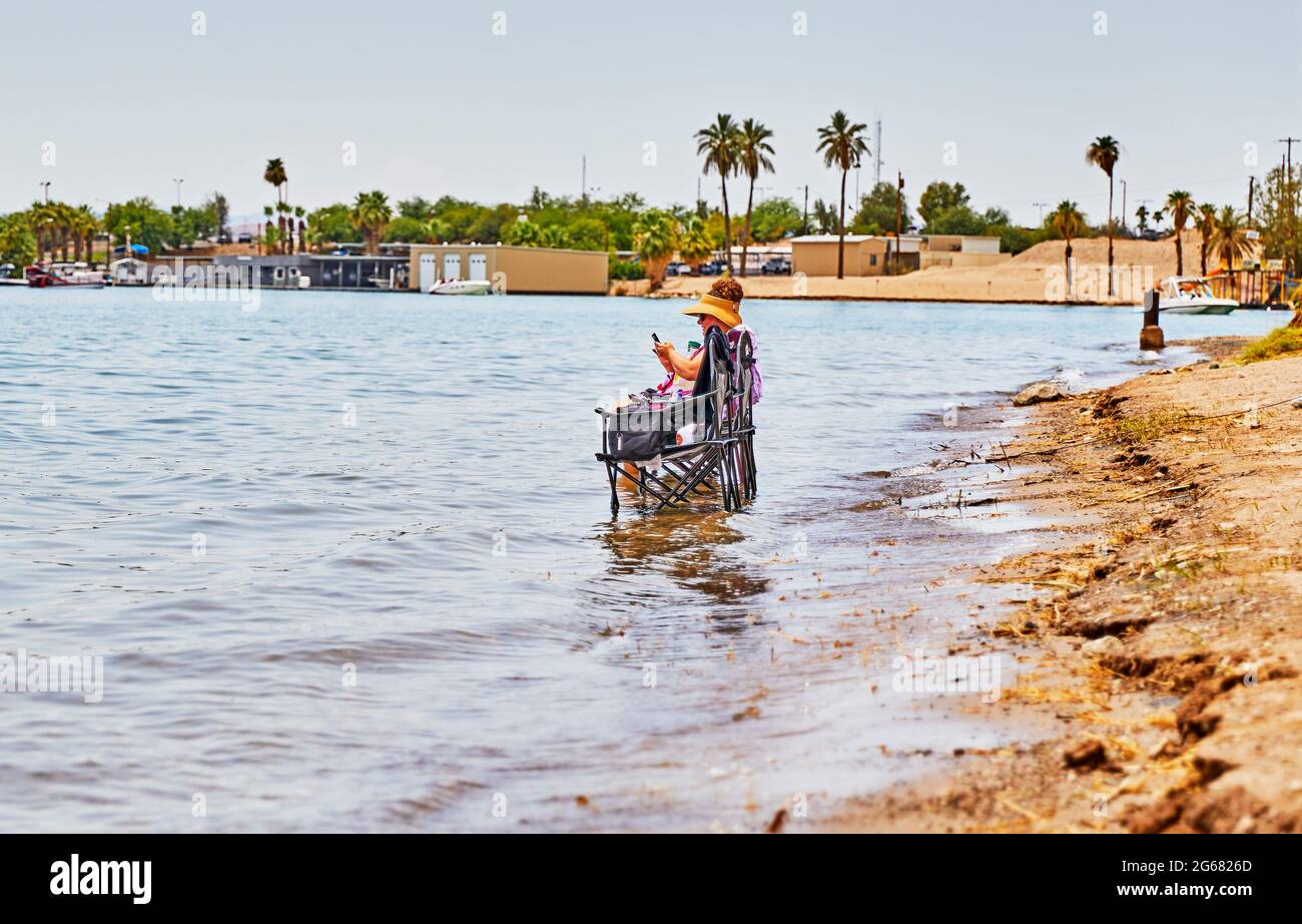 Lake Havasu, Arizona, USA - June 30, 2021: People sitting on chairs in ...