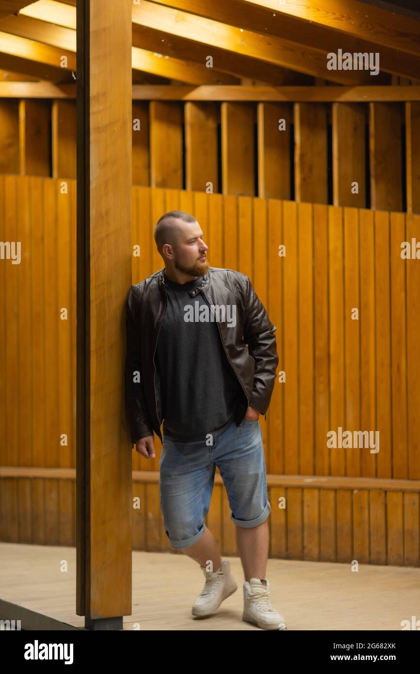 a man stands at a bus stop at night Stock Photo - Alamy